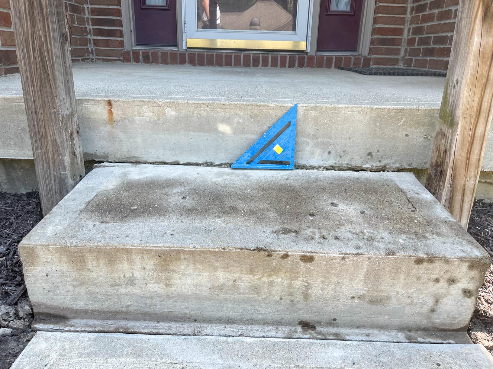 Front step in to home sinking and in need of repair